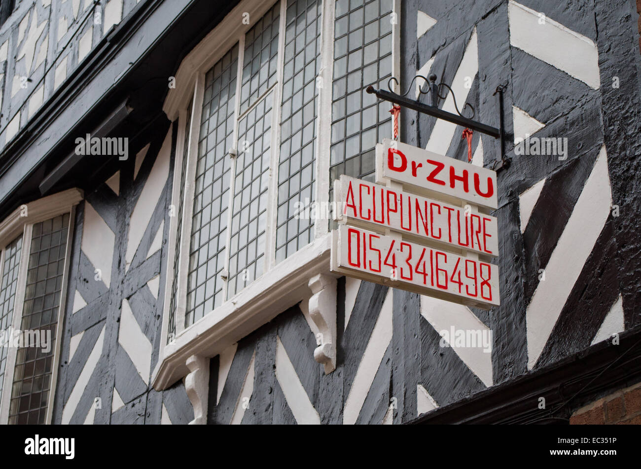 Sign for Dr Zhu offering acupuncture hanging on a half timbered ...