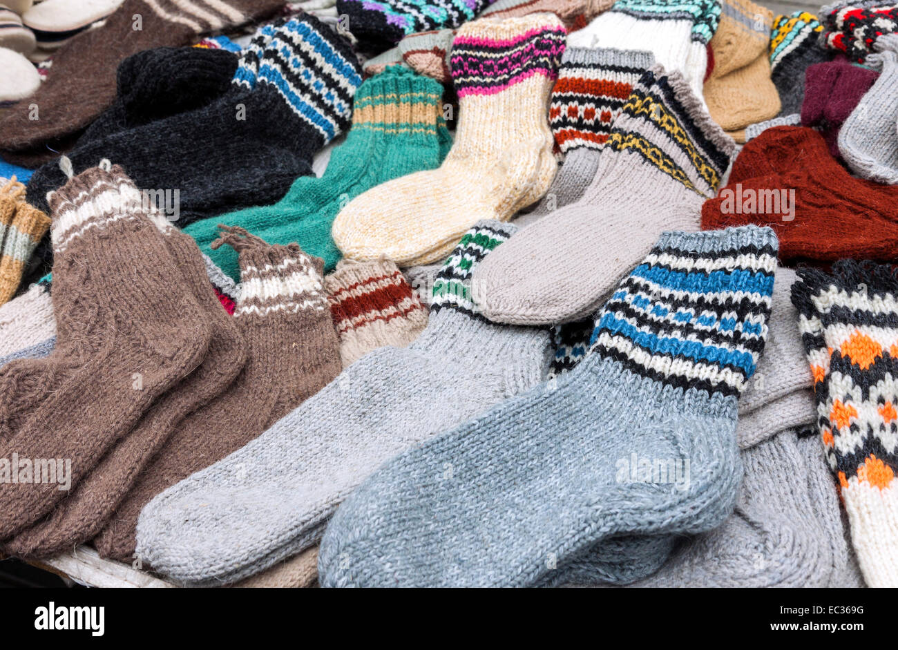 Bunch of handmade colorful woolen socks on the market Stock Photo - Alamy