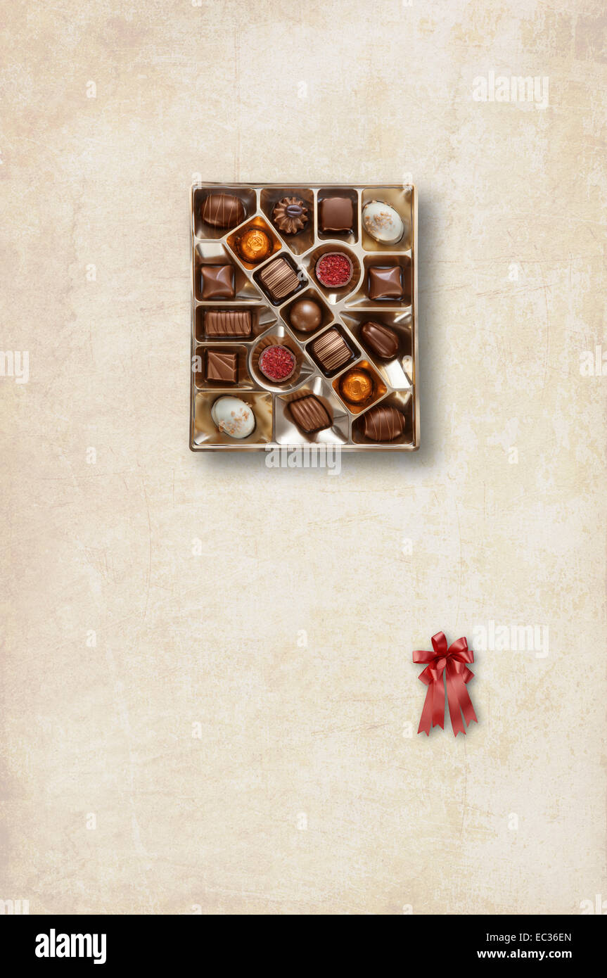 view of box of nice chocolate candies on color back Stock Photo - Alamy