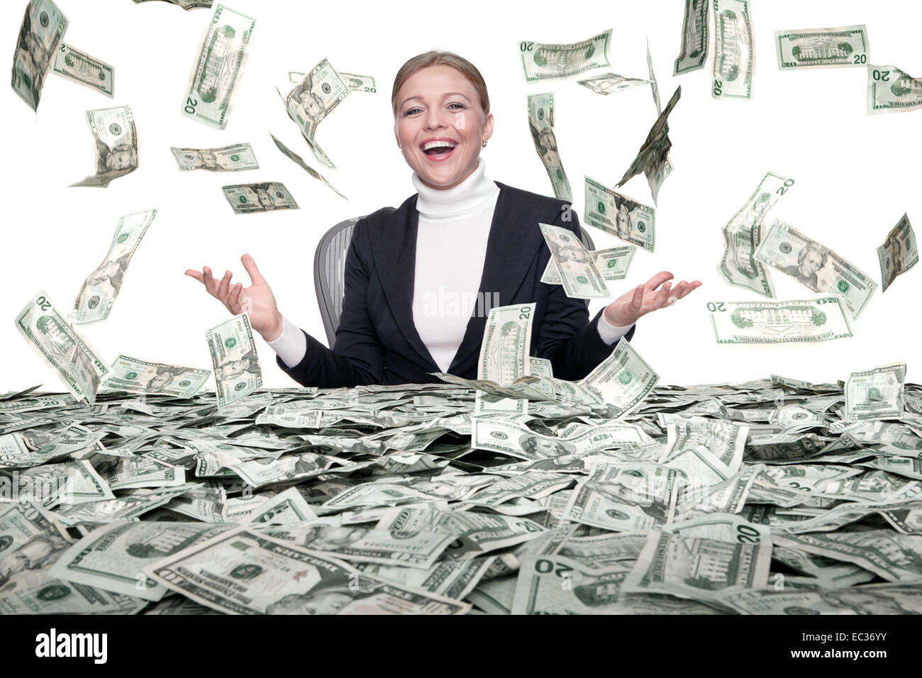 portrait of young woman sitting behind the table full of cash Stock ...