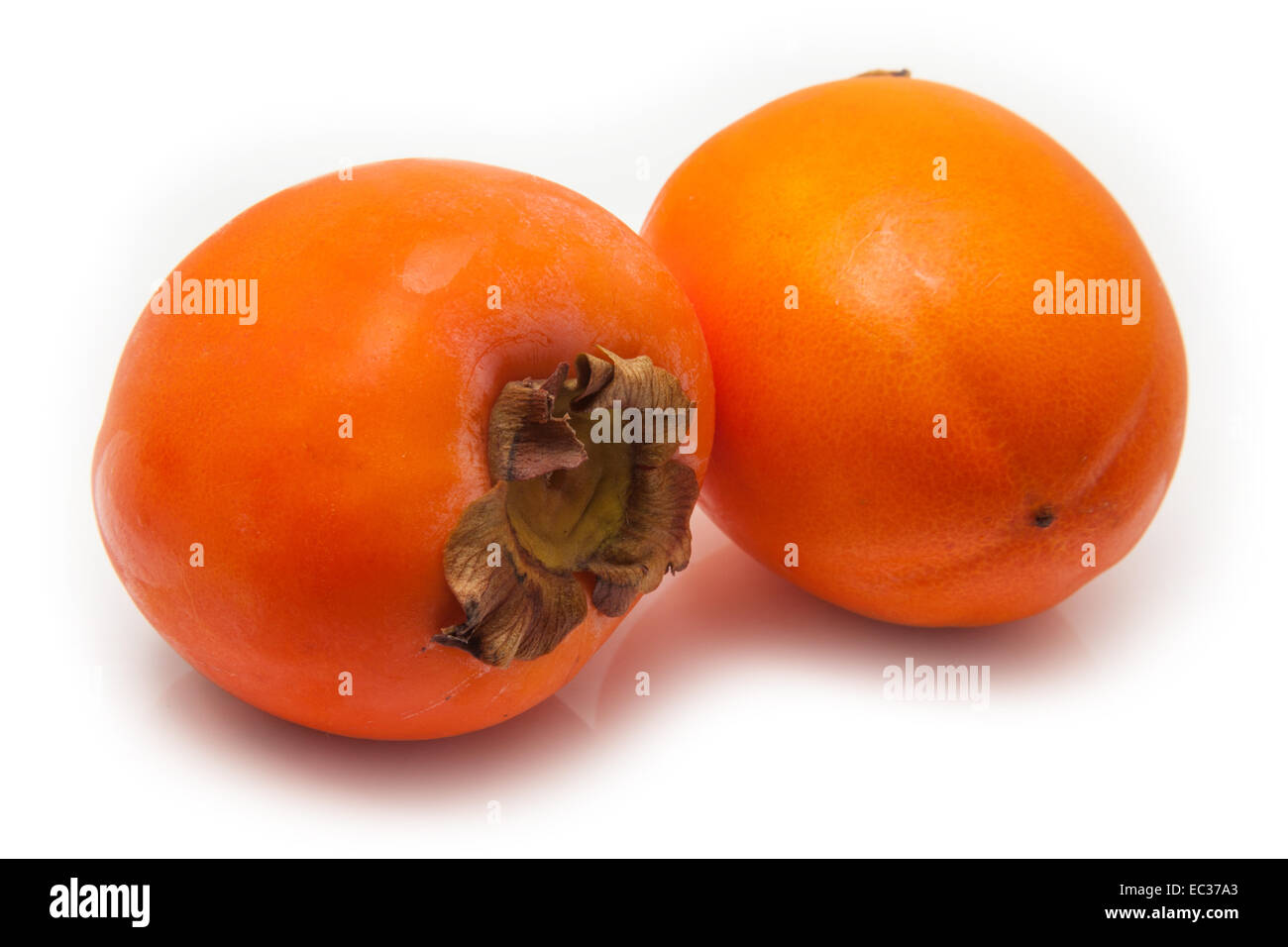 Sharon Fruit isolated on a white studio background Stock Photo - Alamy