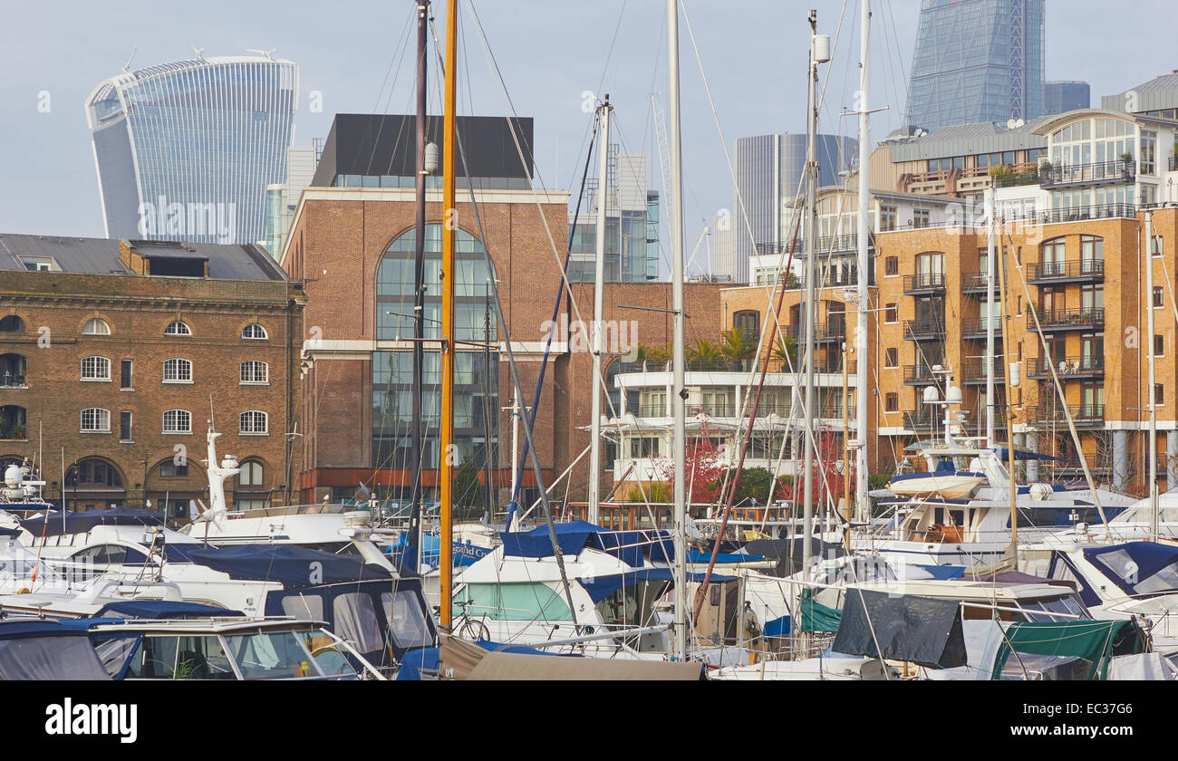 Boats barges and yachts moored in luxury St Katherine Docks marina east ...