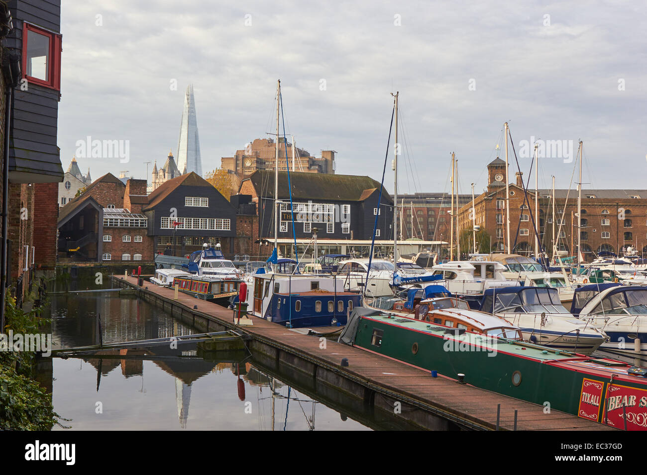 Barges boats and yachts moored in upmarket St Katherine Docks marina ...