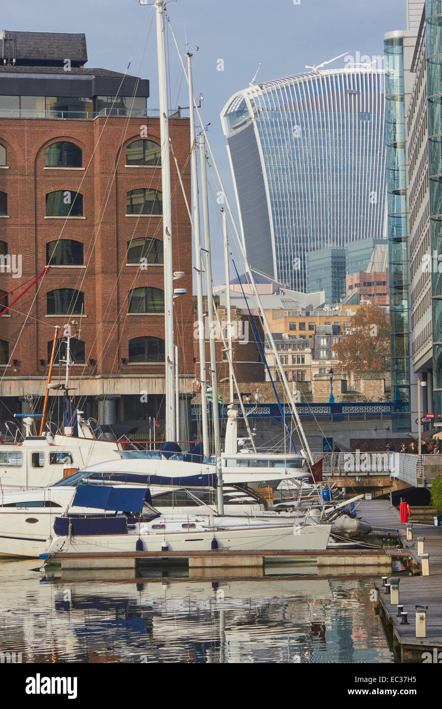 Boats barges and yachts moored in luxury St Katherine Docks marina east ...