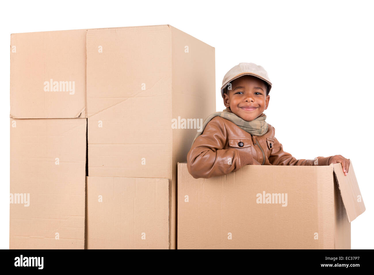 Young boy posing inside a cardboard box playing Stock Photo - Alamy