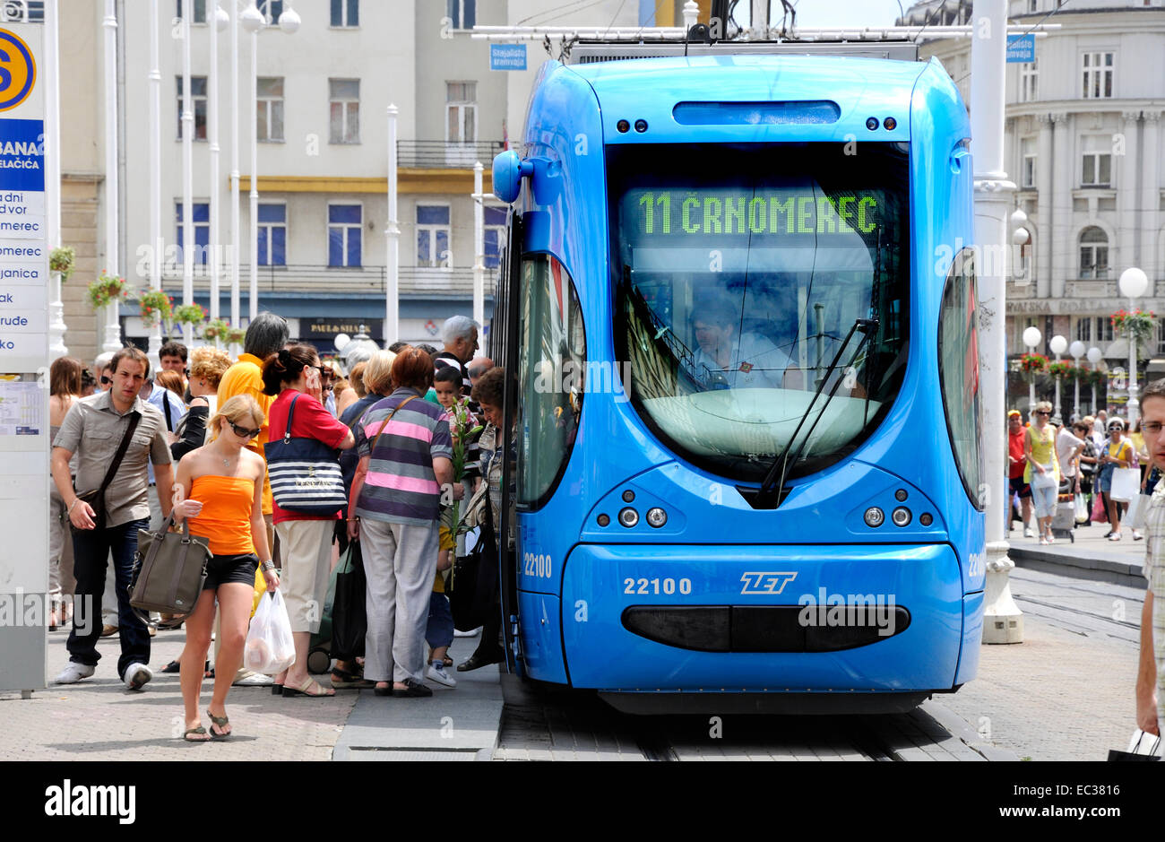 Zagreb, Croatia. Modern tram - passengers getting on at a tram stop ...
