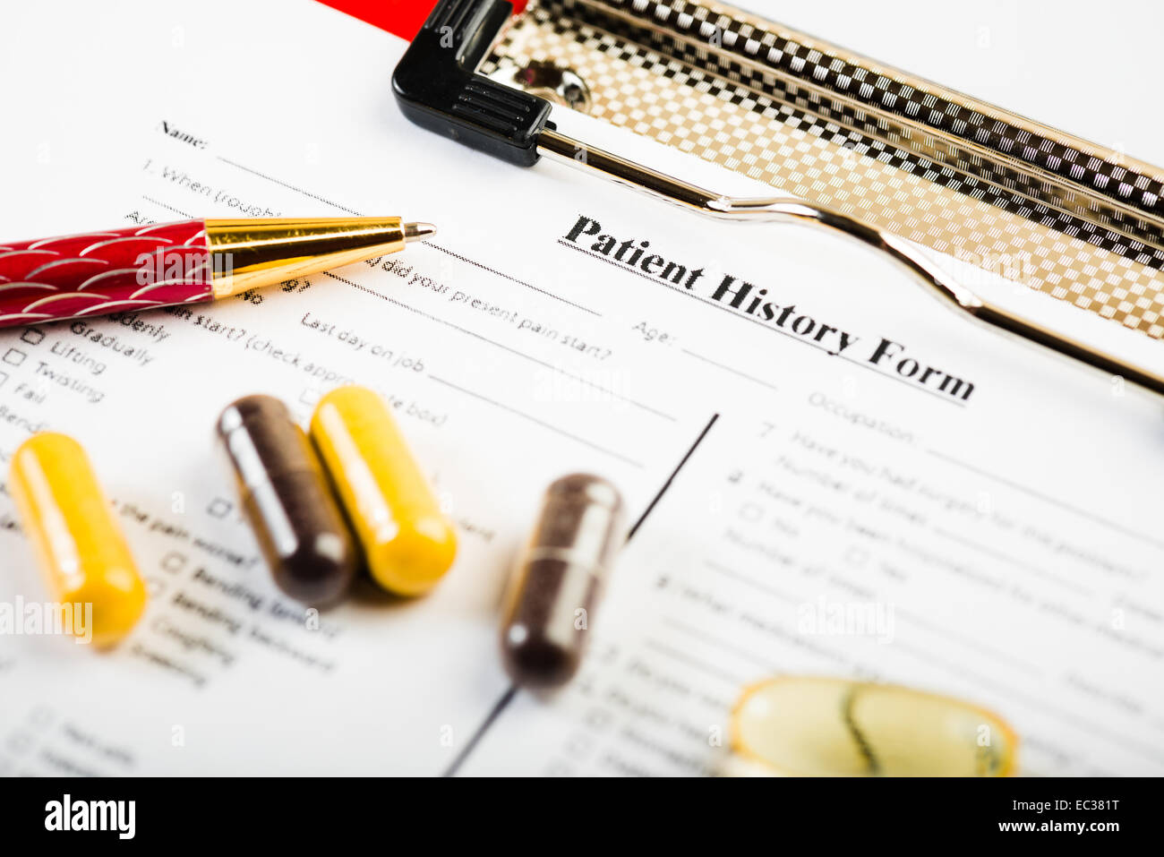 Medical history document with medicine Stock Photo - Alamy