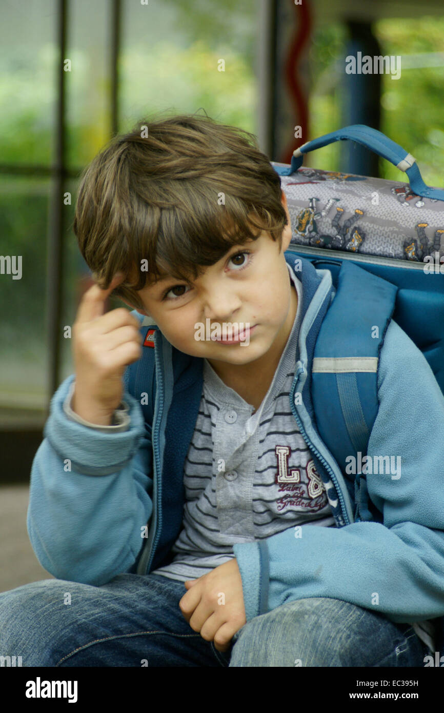 a school boy is sad Stock Photo - Alamy