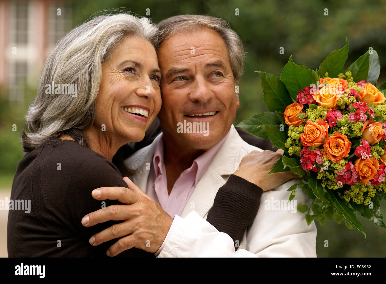 older couple hugging in Stock Photo - Alamy