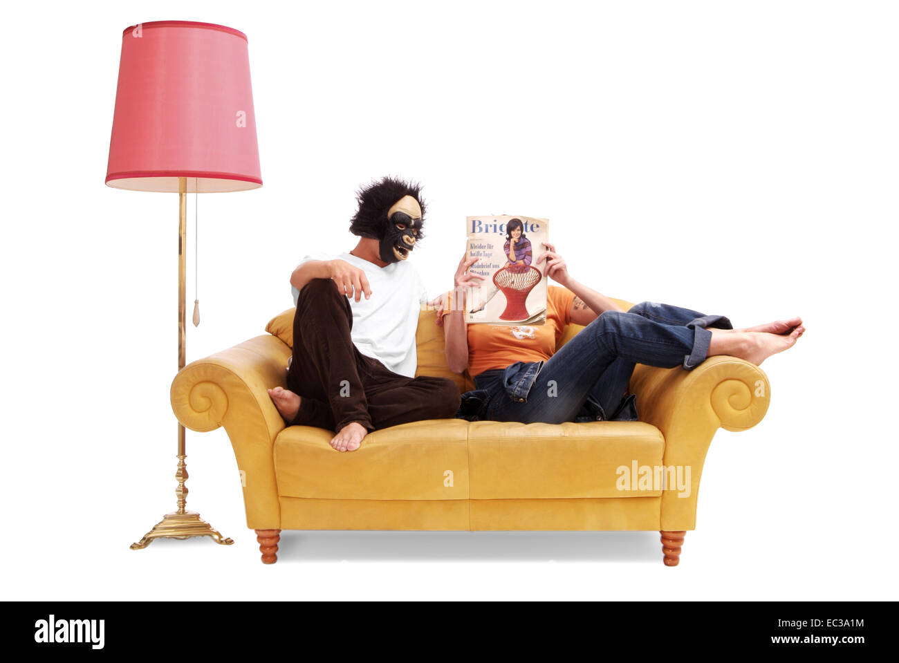 Amorous couple sitting on sofa hi-res stock photography and images - Alamy