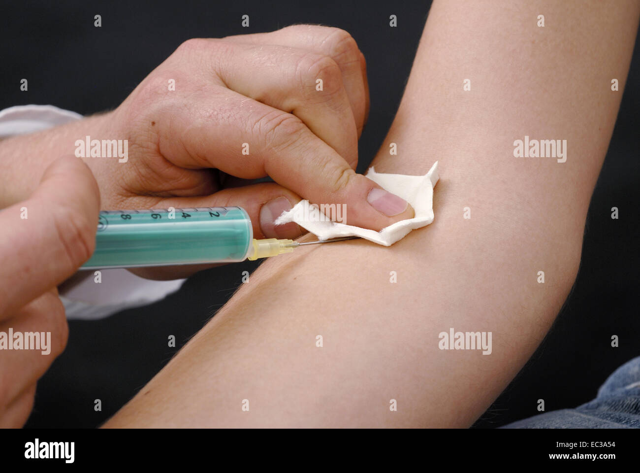 Doctor Giving an Injection to Patient Stock Photo - Alamy