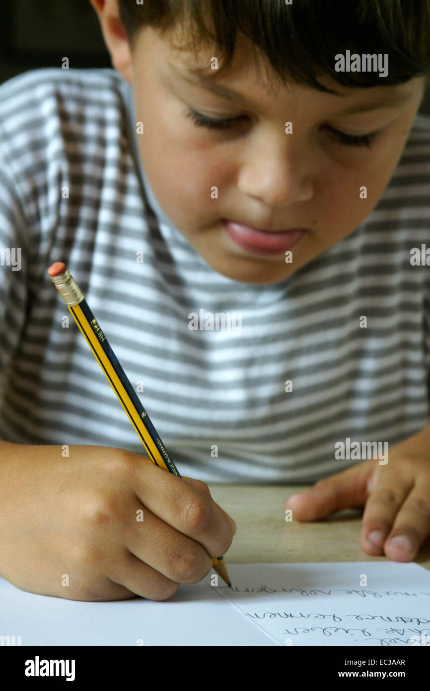 Little boy does homework Stock Photo - Alamy