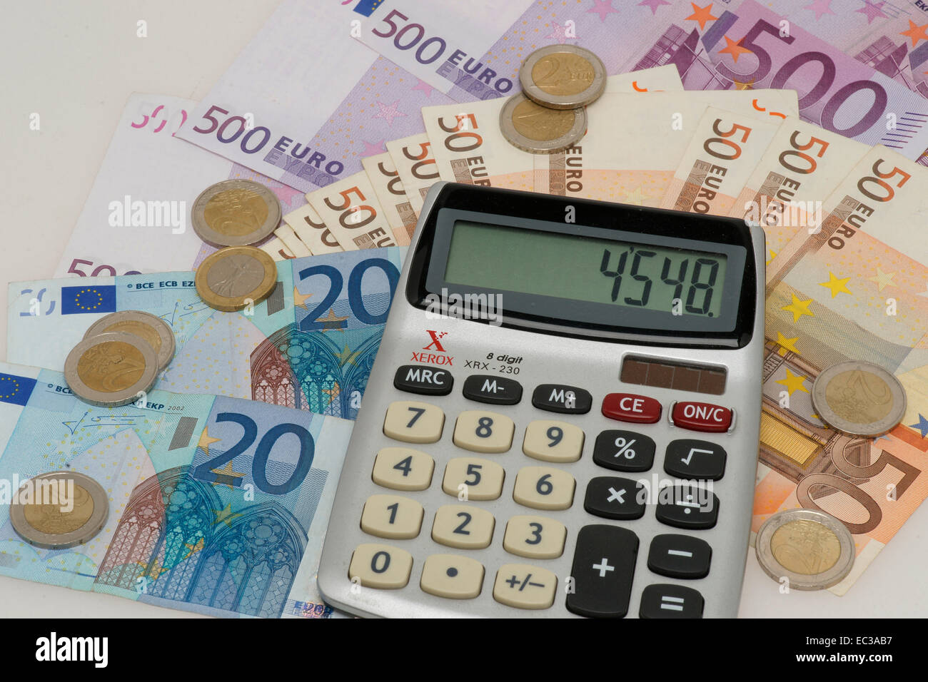 calculater and money Stock Photo - Alamy