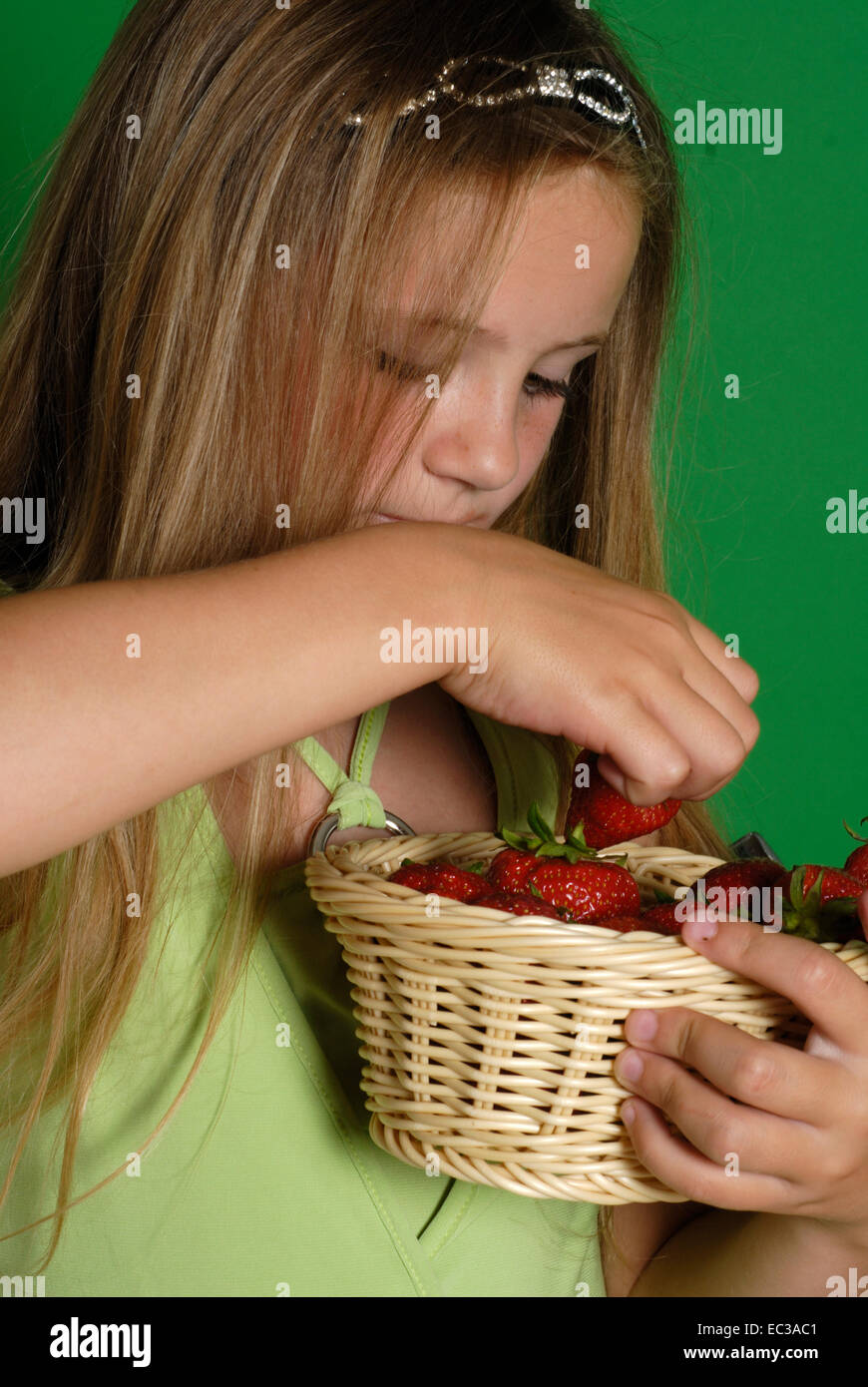 Girl eating Strawberry Stock Photo - Alamy