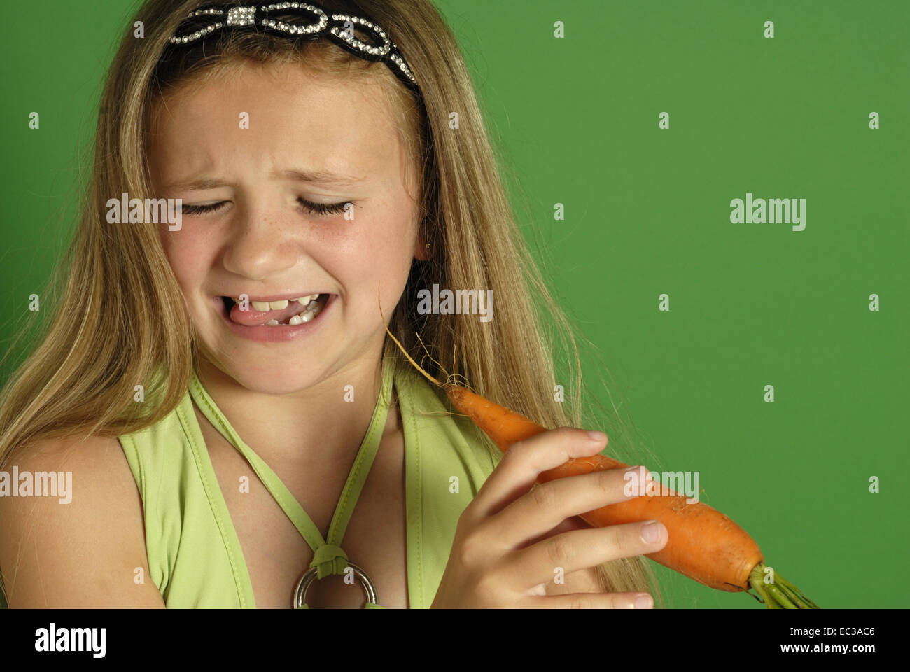 Girl eating Carrot Stock Photo - Alamy