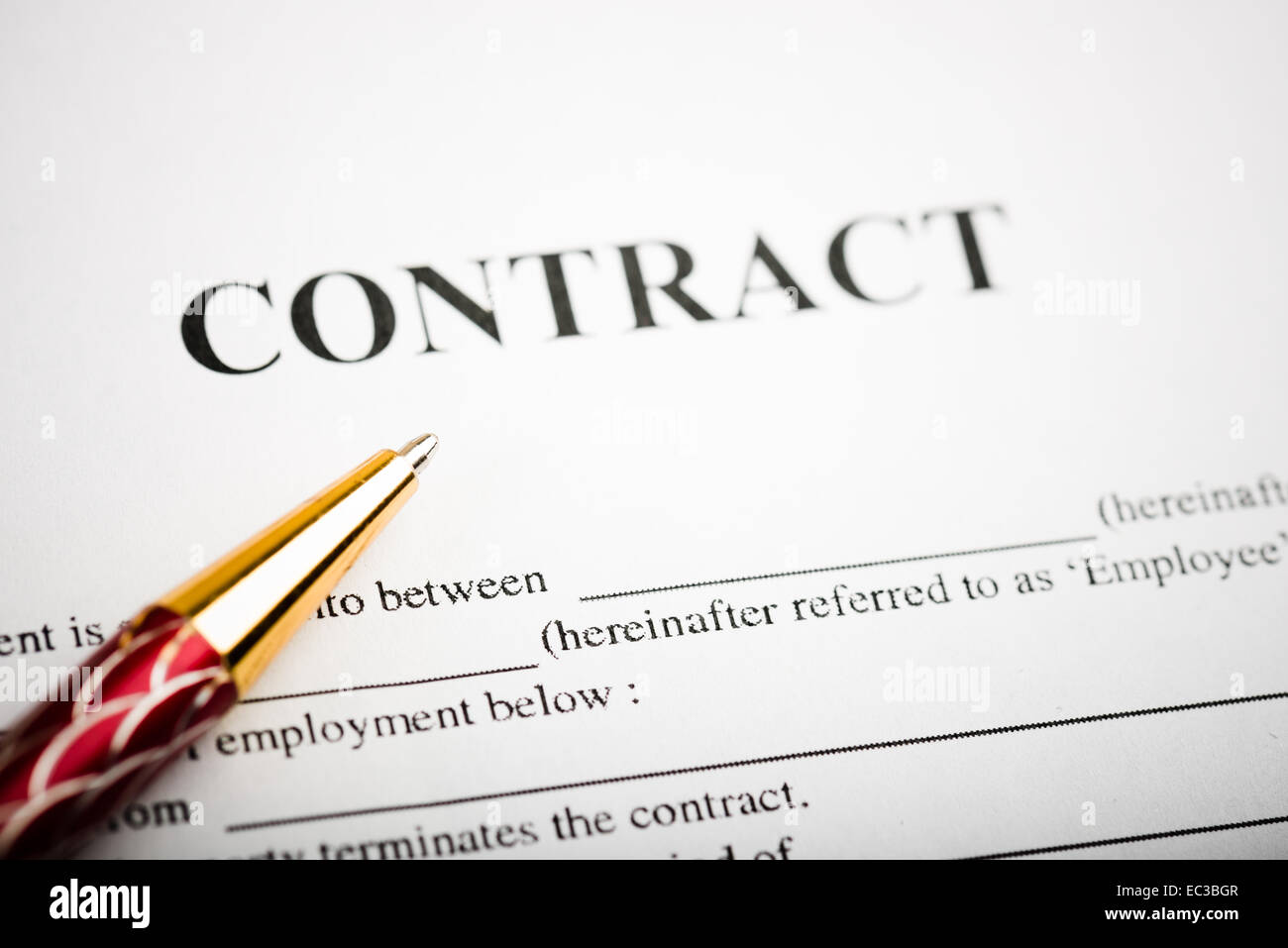 Pen on the contract papers Stock Photo - Alamy