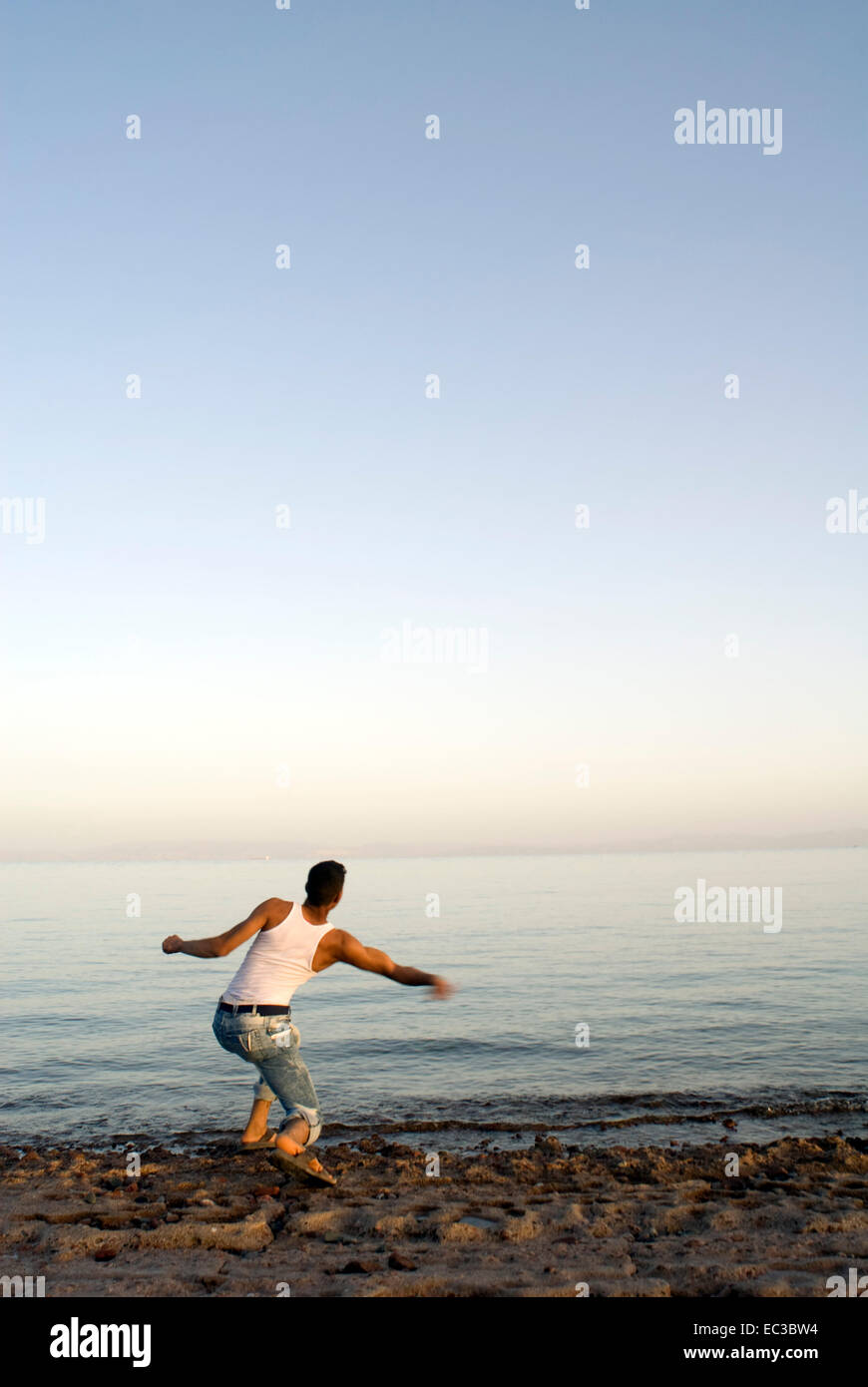 Man Throwing Stones High Resolution Stock Photography and Images - Alamy