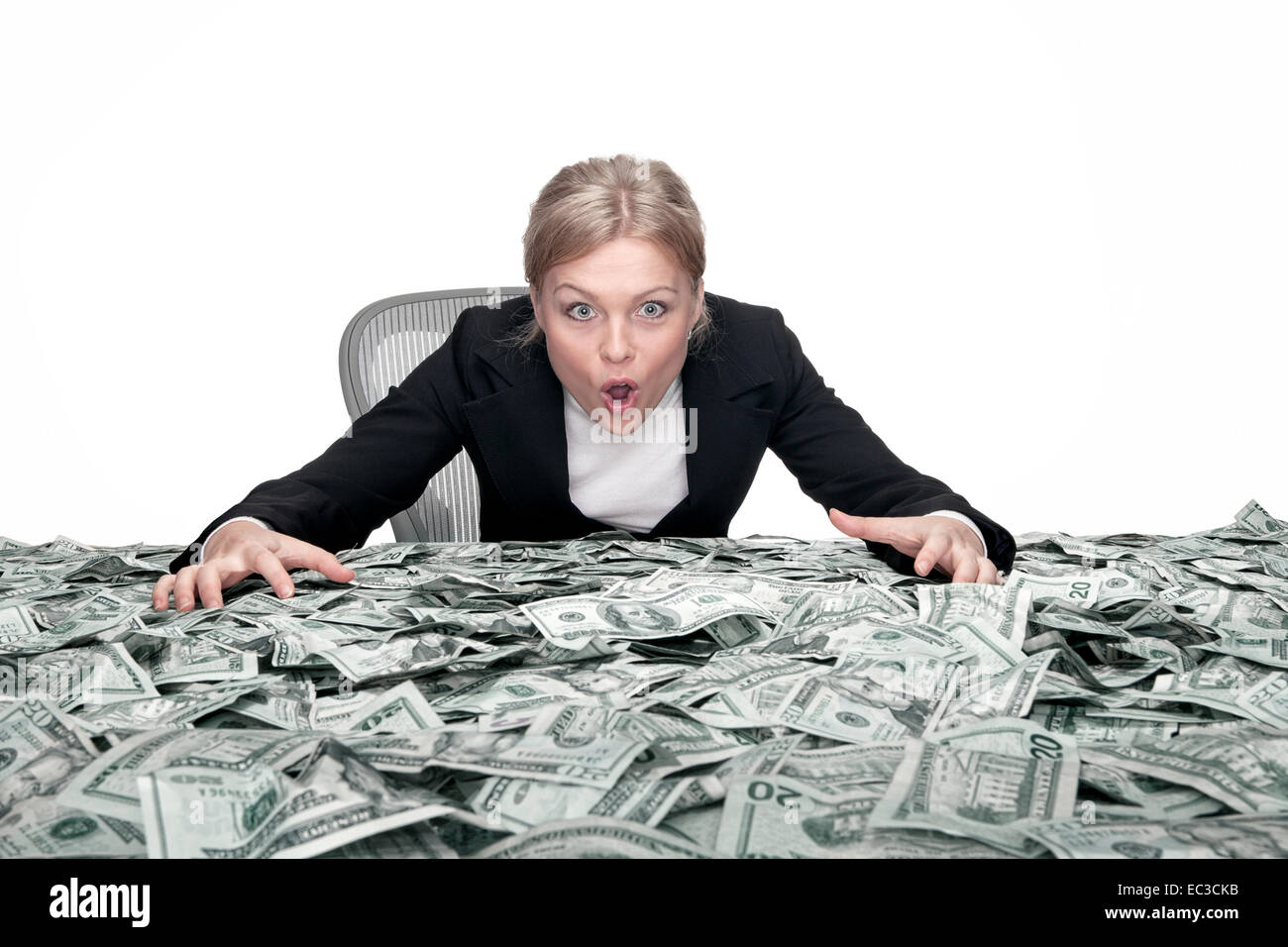 portrait of young woman sitting behind the table full of cash Stock ...