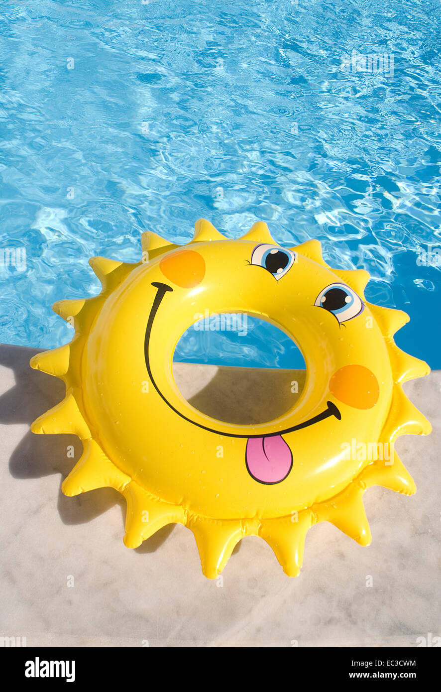 Yellow Floating Tire at the Pool Boarder Stock Photo - Alamy