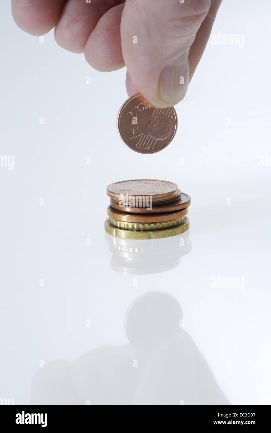 Hand and Coins Stock Photo - Alamy