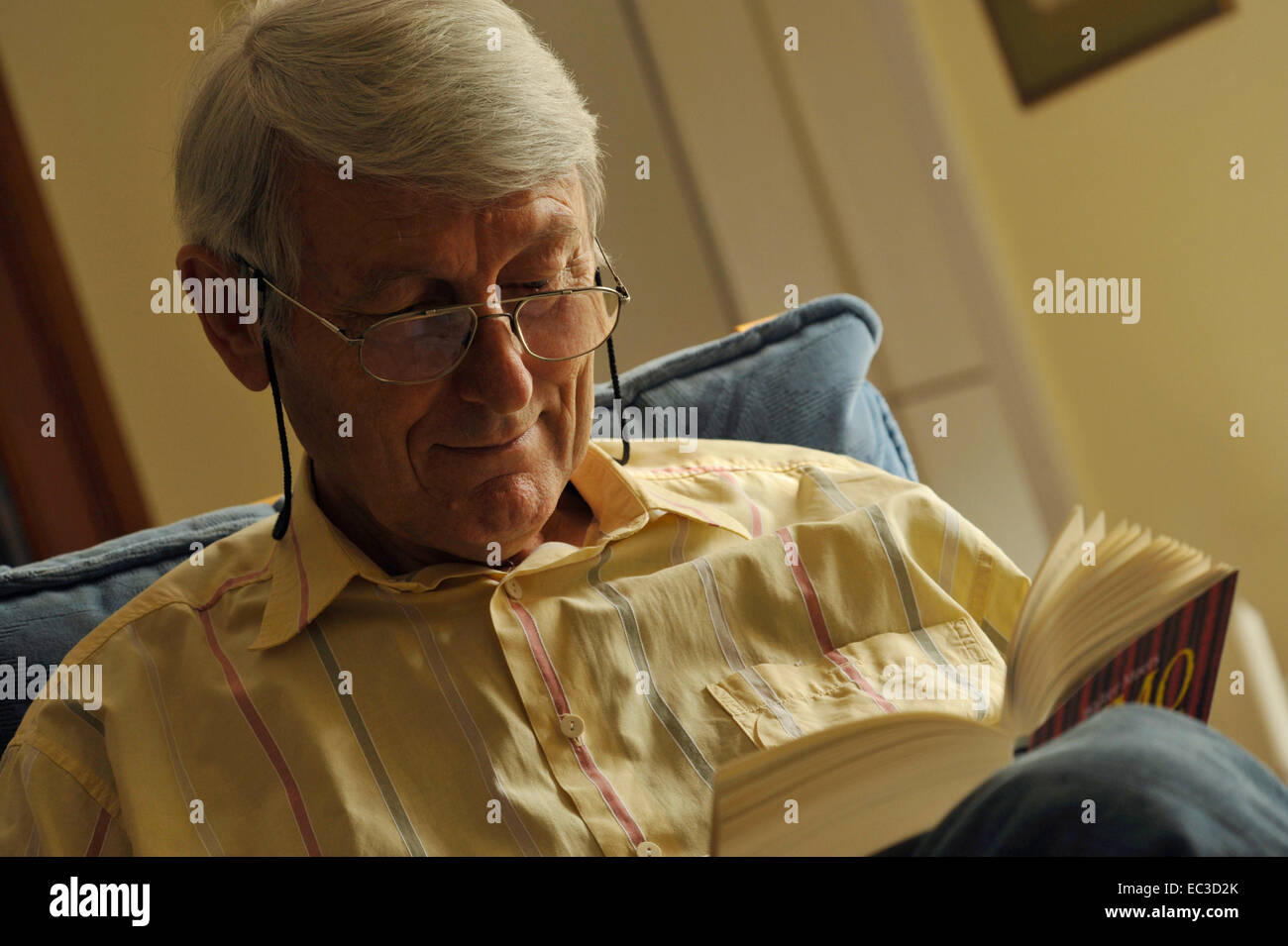 Retiree Reading a Book Stock Photo - Alamy