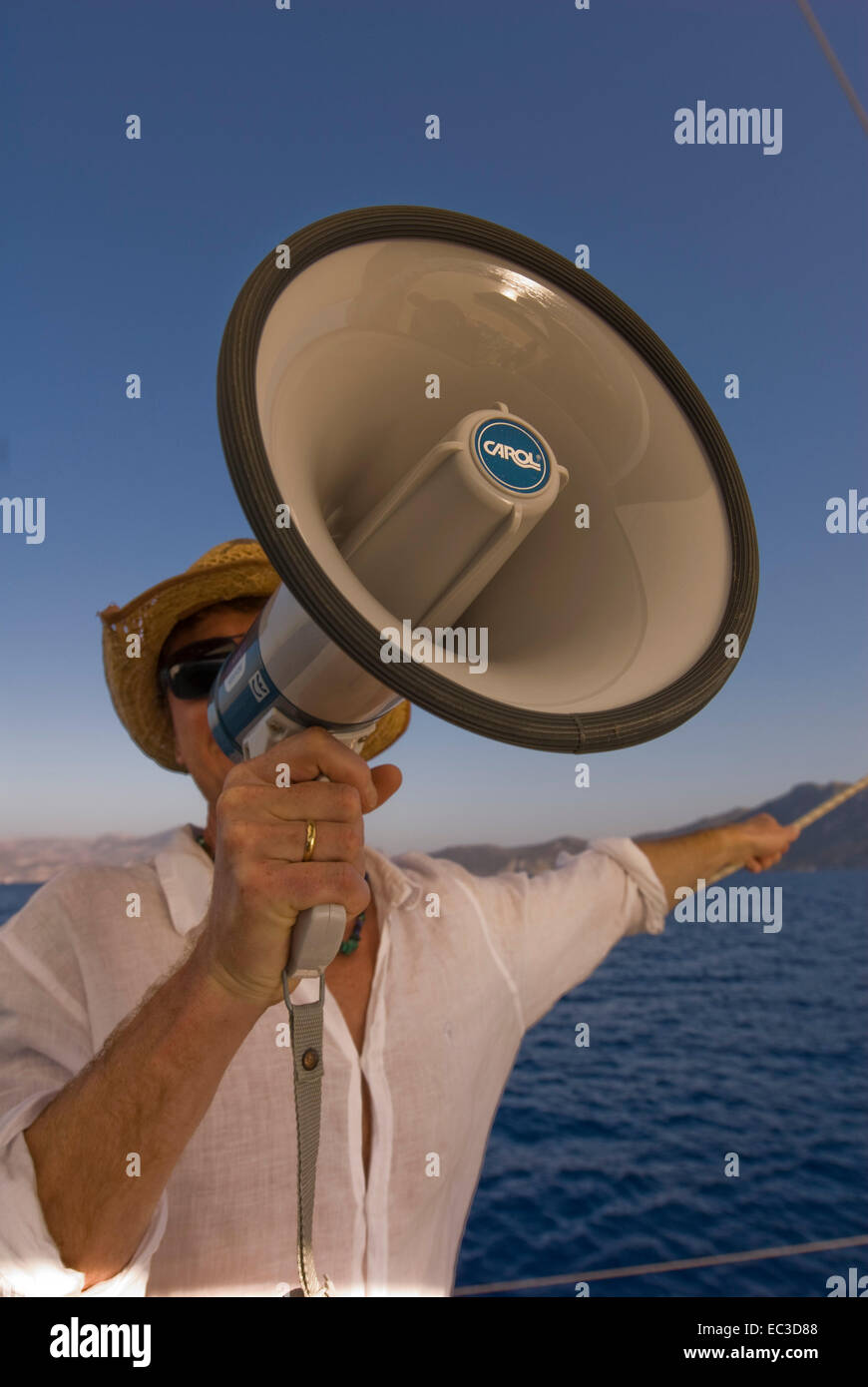Man talks into a Megaphone Stock Photo - Alamy