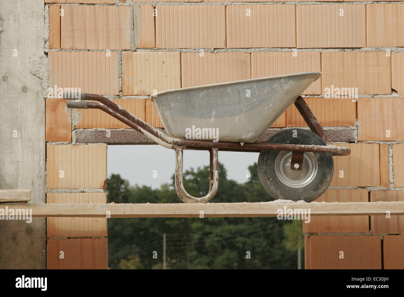 Wheelbarrow on Construction Site Stock Photo - Alamy