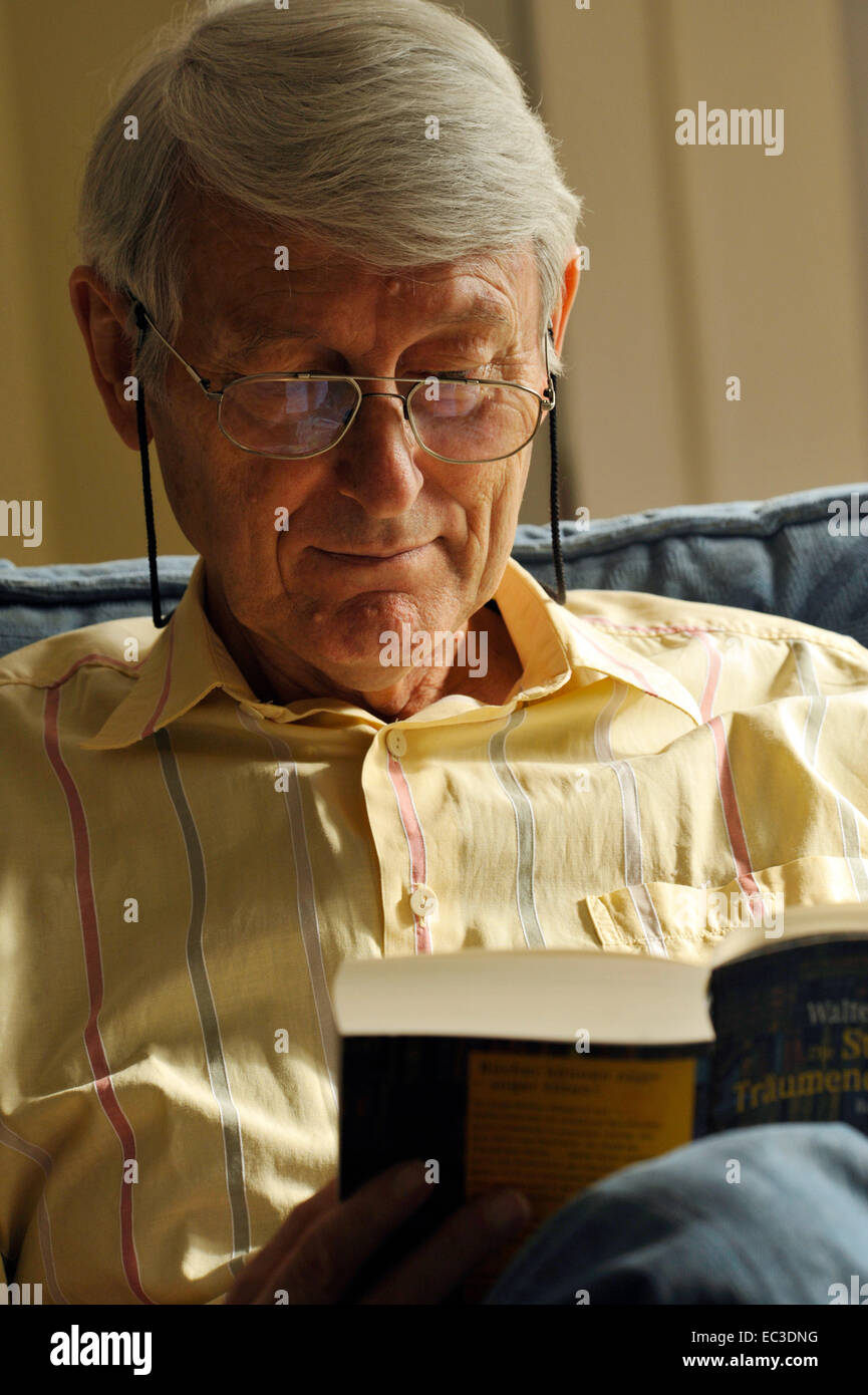 Retiree Reading a Book Stock Photo - Alamy