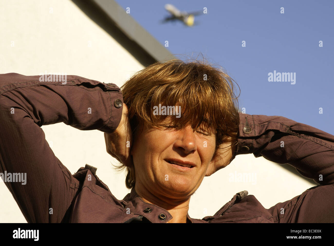 Airplane noise ears hi-res stock photography and images - Alamy
