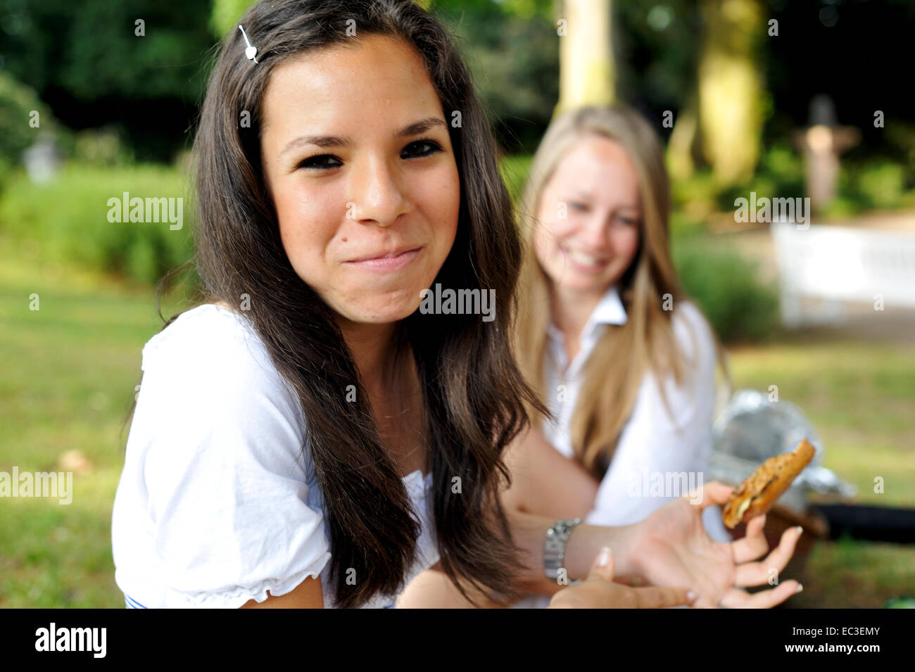 Two women share snack hi-res stock photography and images - Alamy