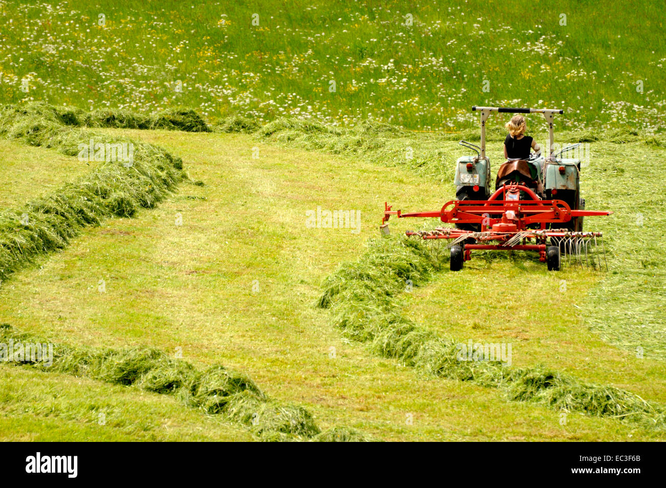 Tractor Turning Grass Stock Photo - Alamy