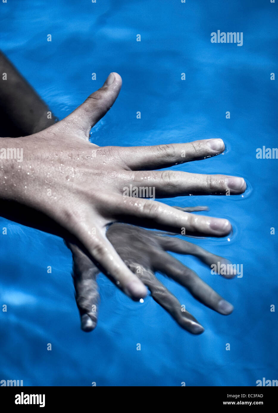 Two hands in water Stock Photo - Alamy