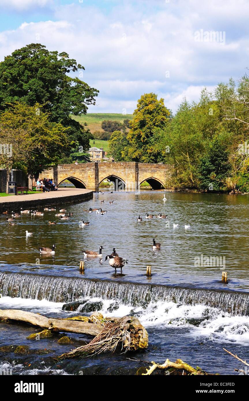 View along the River Wye towards the medieval bridge with a weir in the ...