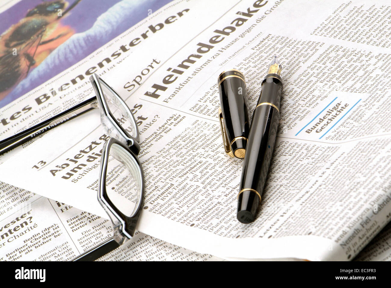 Newspaper with Glasses and Pen Stock Photo - Alamy