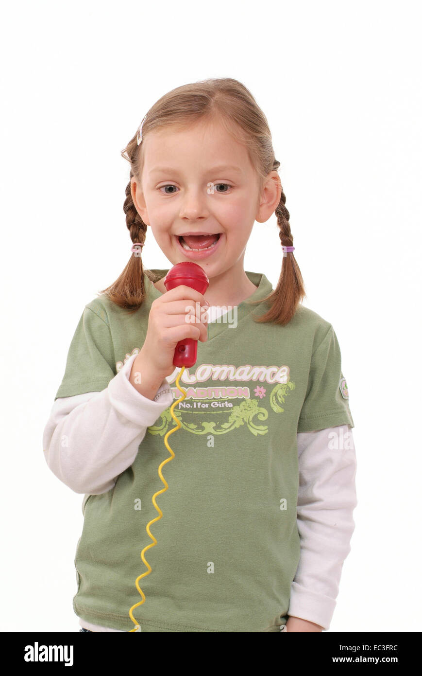 Young Girl singing Karaoke Stock Photo - Alamy
