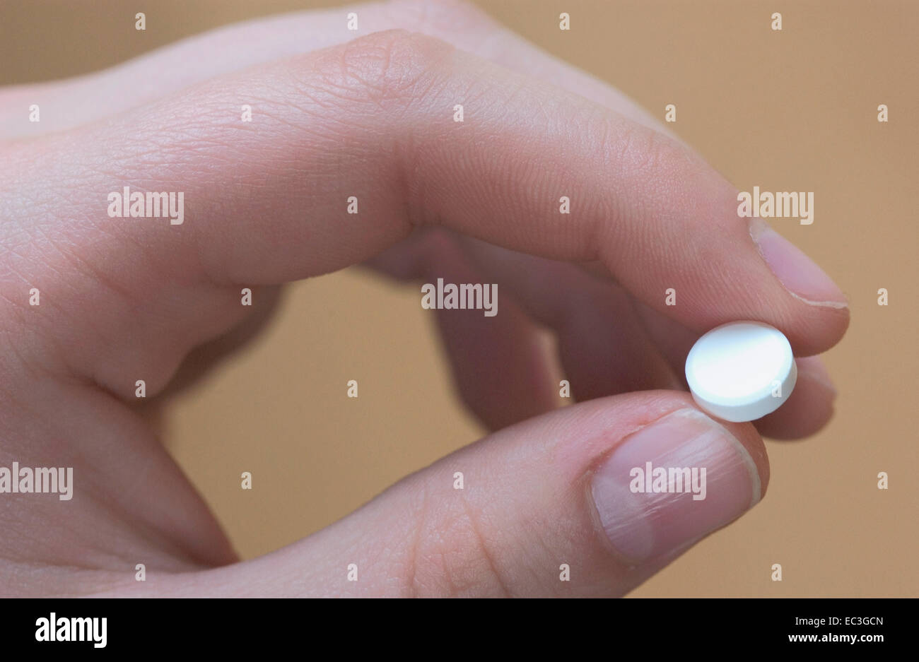 Hand with Pill Stock Photo - Alamy