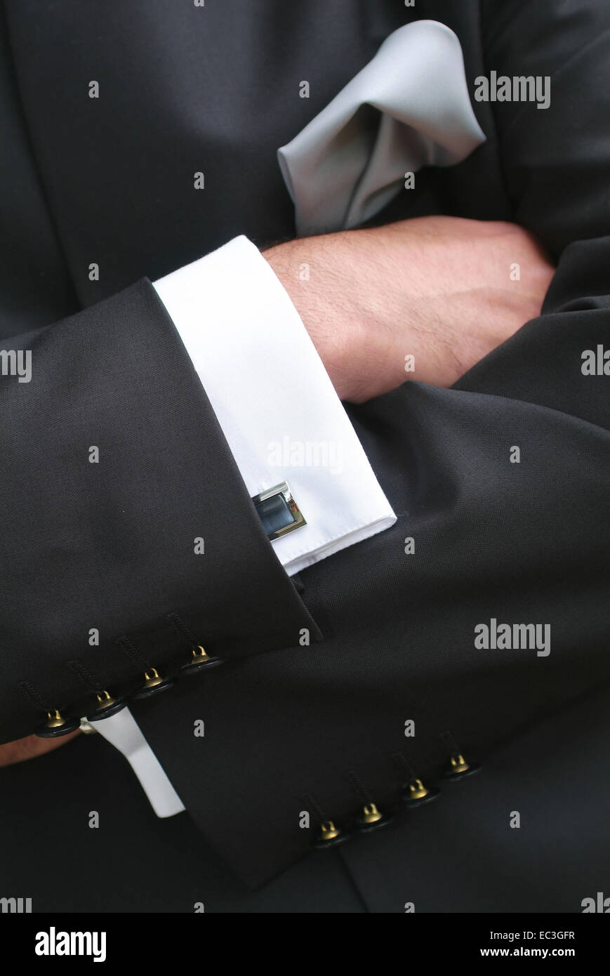 Man wearing Suit with Arms crossed Stock Photo - Alamy