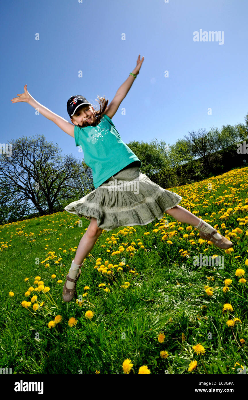 Small girl jumping hi-res stock photography and images - Alamy