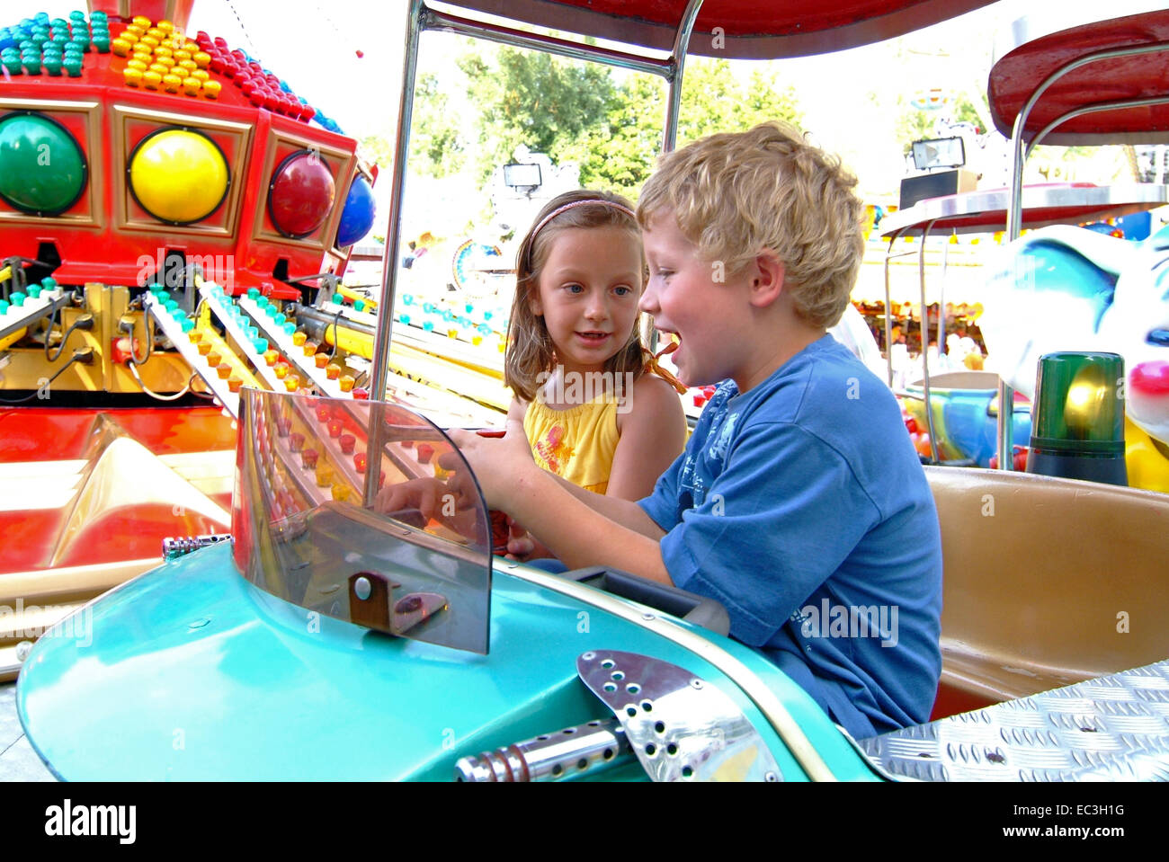 Children sitting in a Carousel Stock Photo - Alamy
