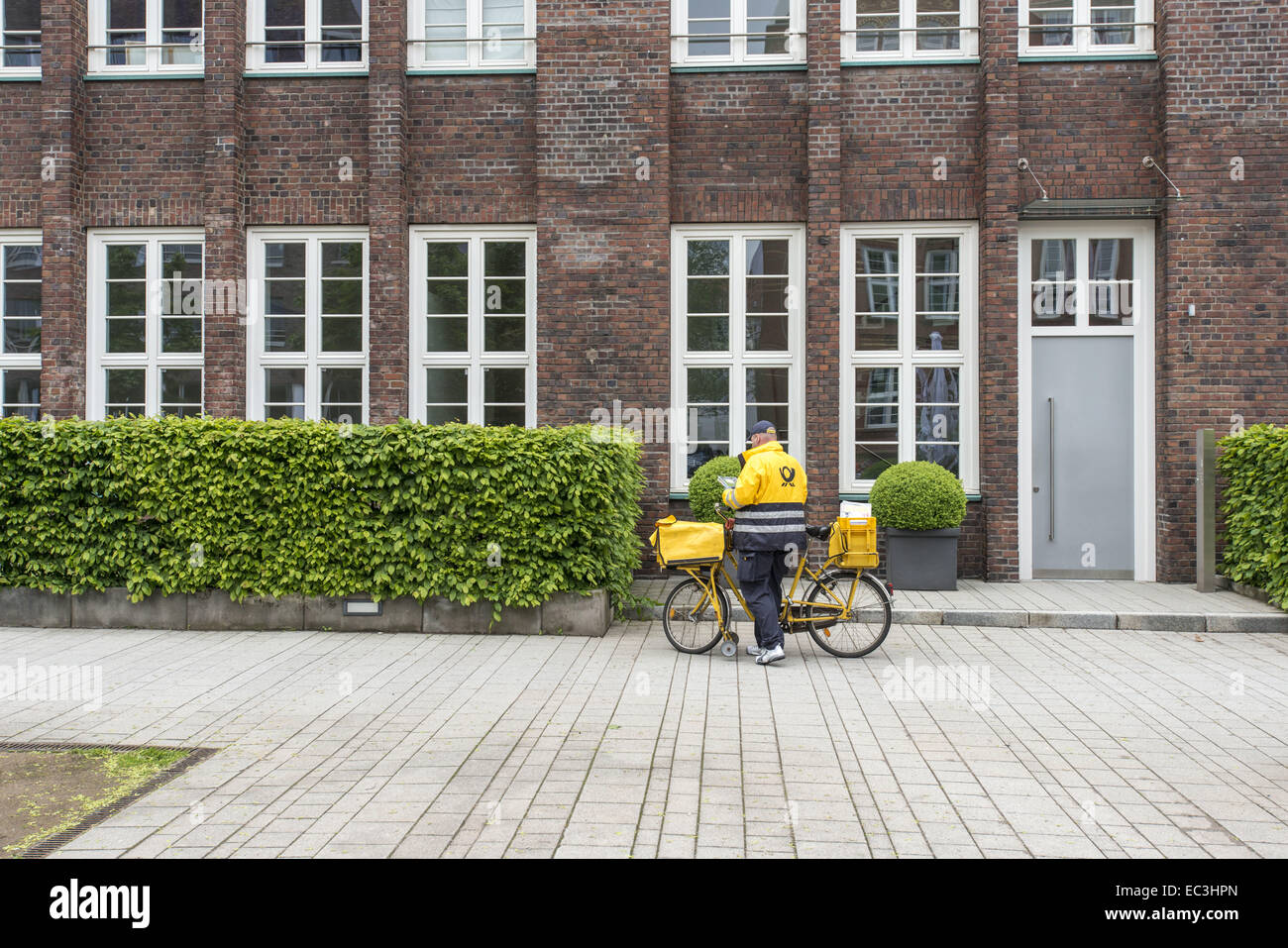 Yellow bike of postman hi-res stock photography and images - Alamy