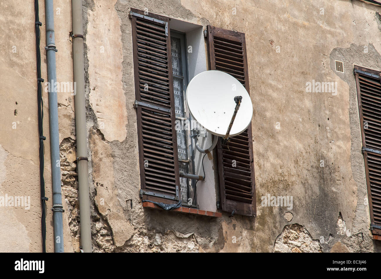 satilite receiver at an old house Stock Photo - Alamy