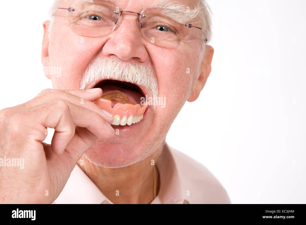 Old Man Putting in his Dentures Stock Photo - Alamy Old Man Putting in his Dentures Stock Photo - Alamy