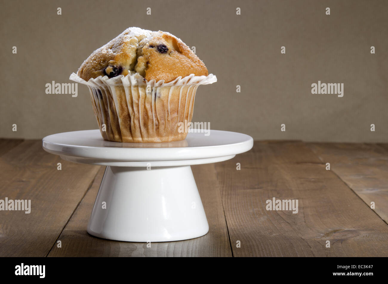 one home made blueberry muffin on a cakestand Stock Photo - Alamy