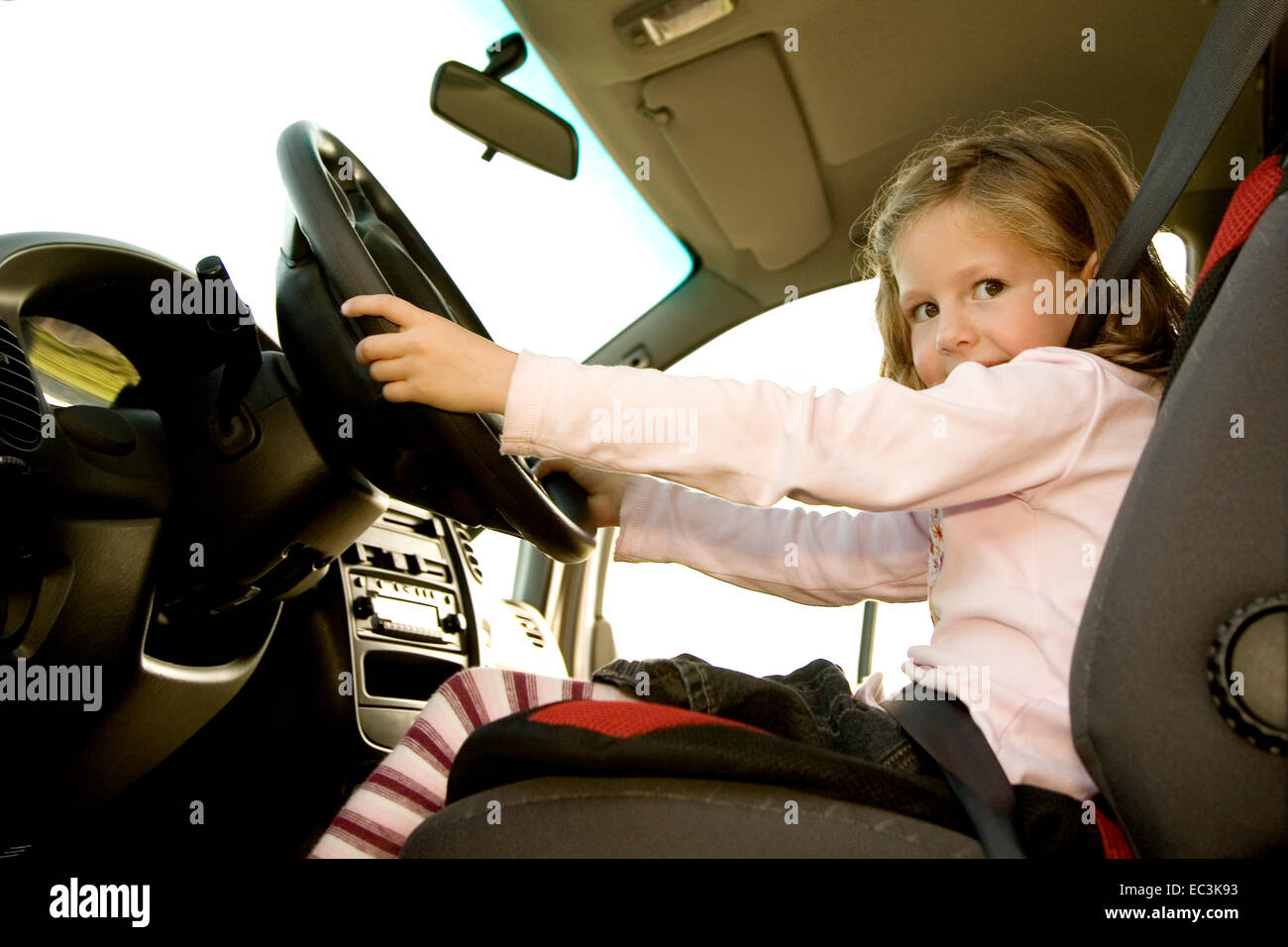 Girl behind Steering Wheel Stock Photo - Alamy