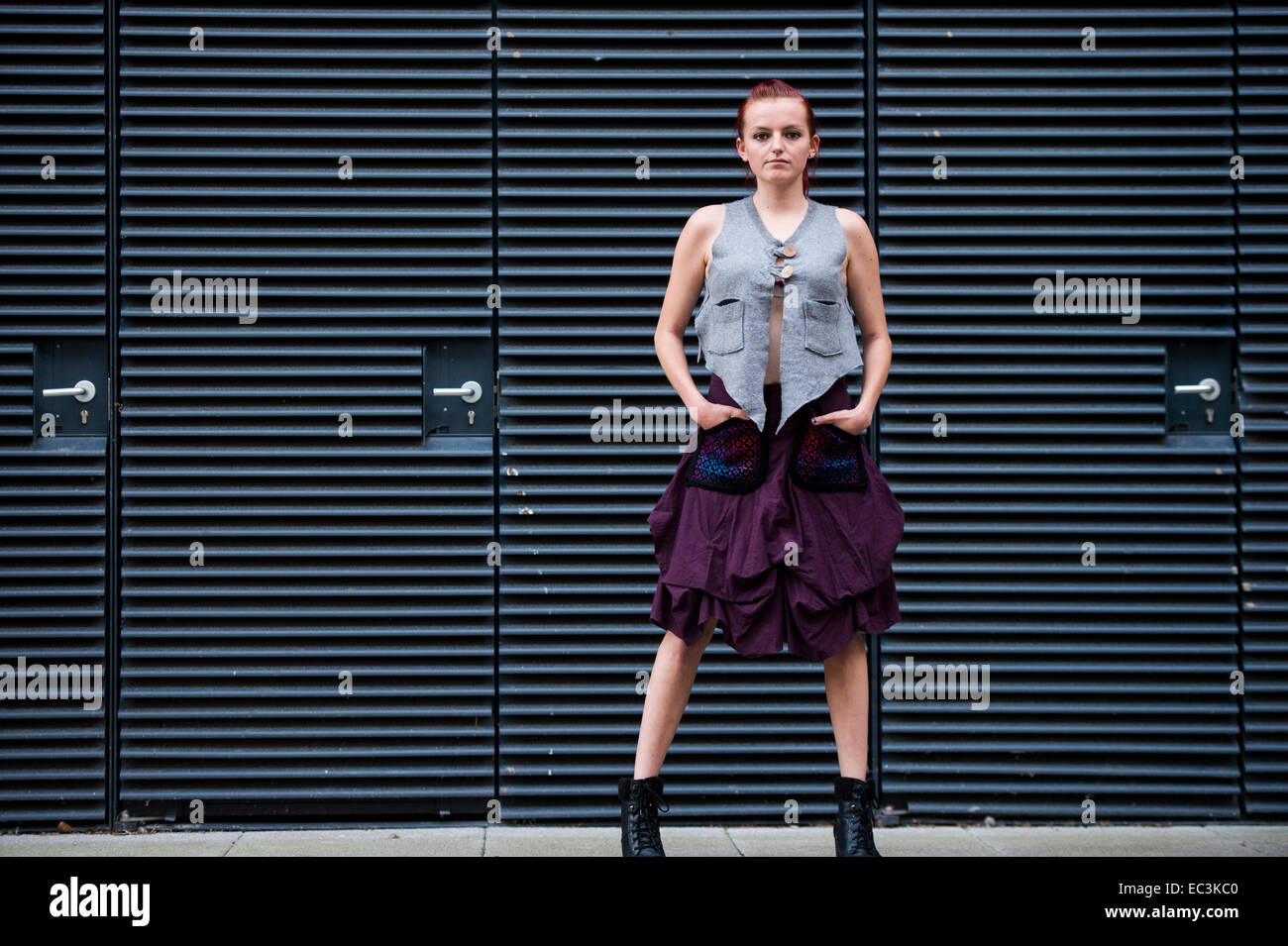 A young woman teenage girl modeling wearing upcycled recycled clothes ...