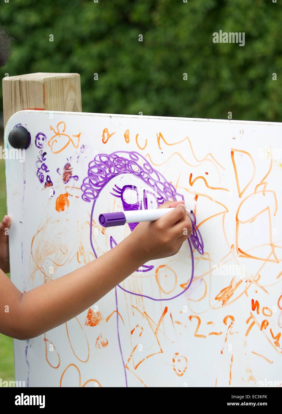 Child draws on an outdoor whiteboard Stock Photo - Alamy