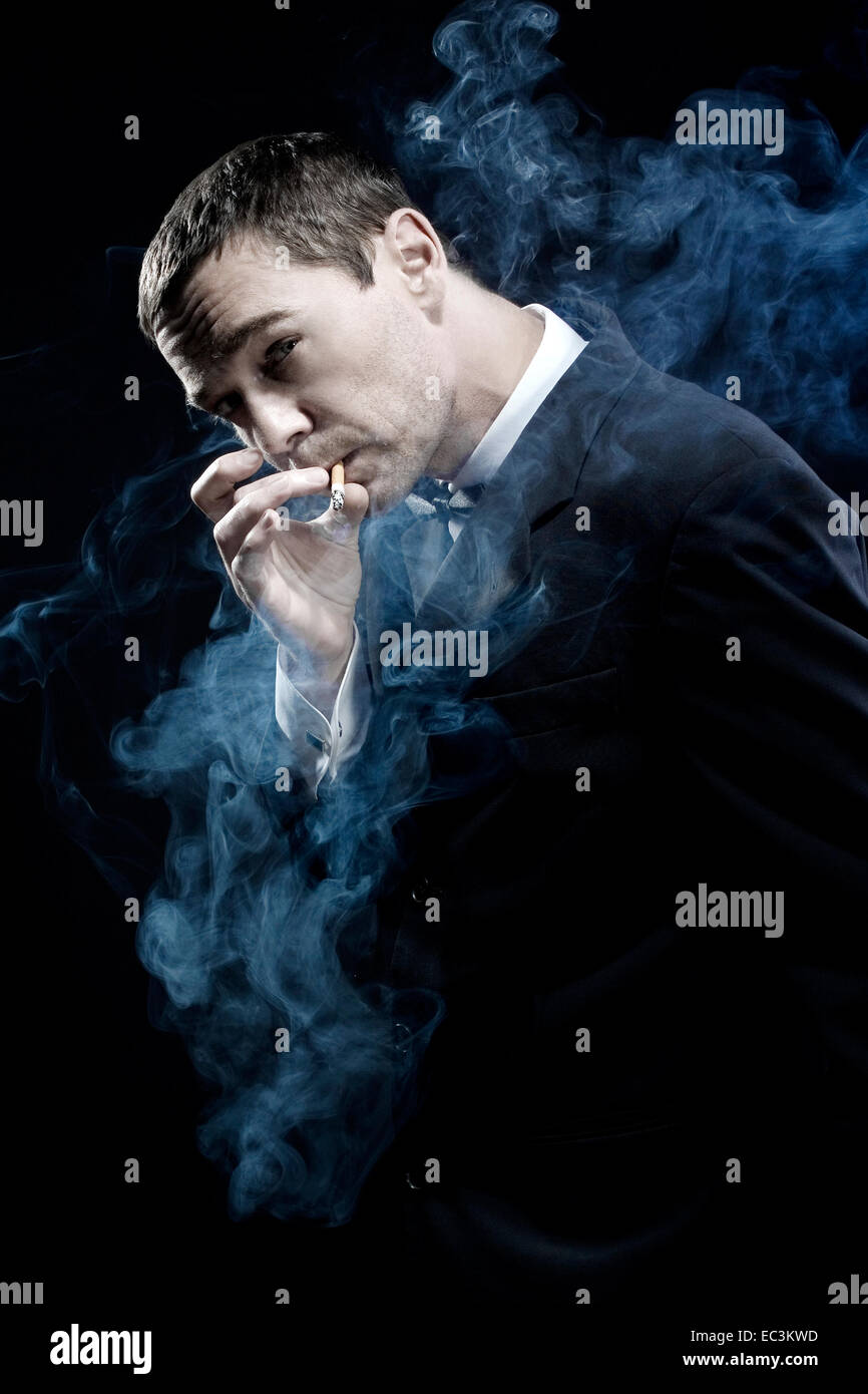 Man with suit and cigarette hi-res stock photography and images - Alamy