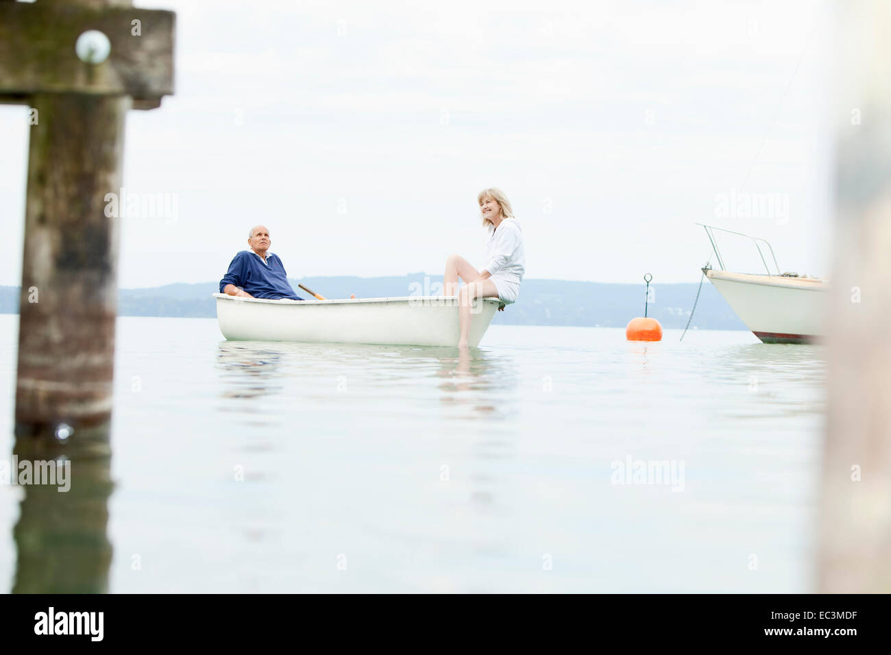 Older Couple in Rowboat Stock Photo - Alamy
