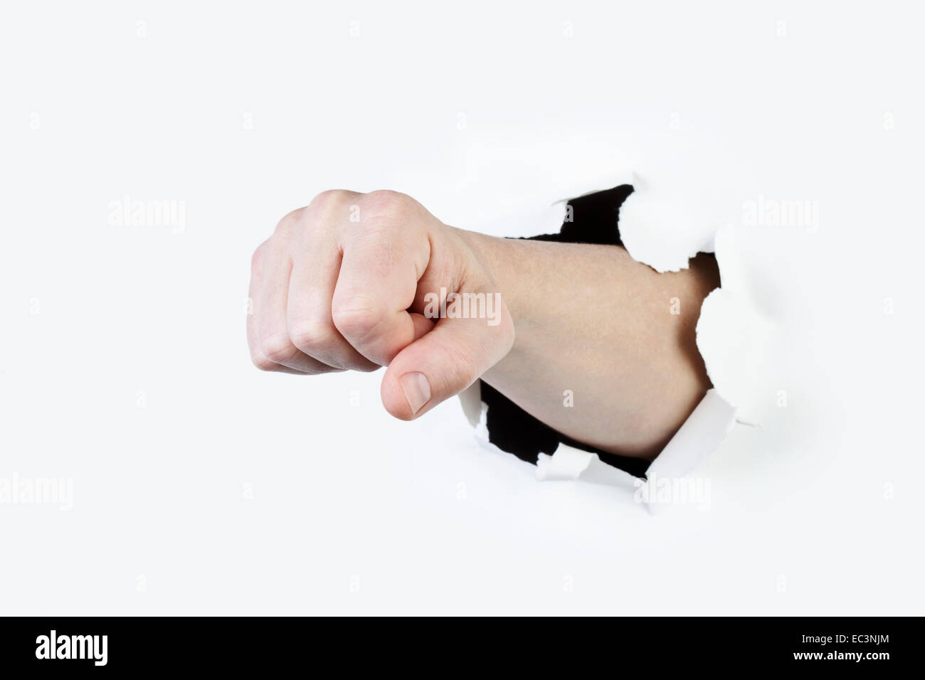 Fist punching through paper hi-res stock photography and images - Alamy