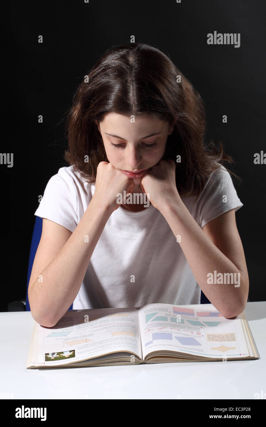 Student reading a book Stock Photo - Alamy